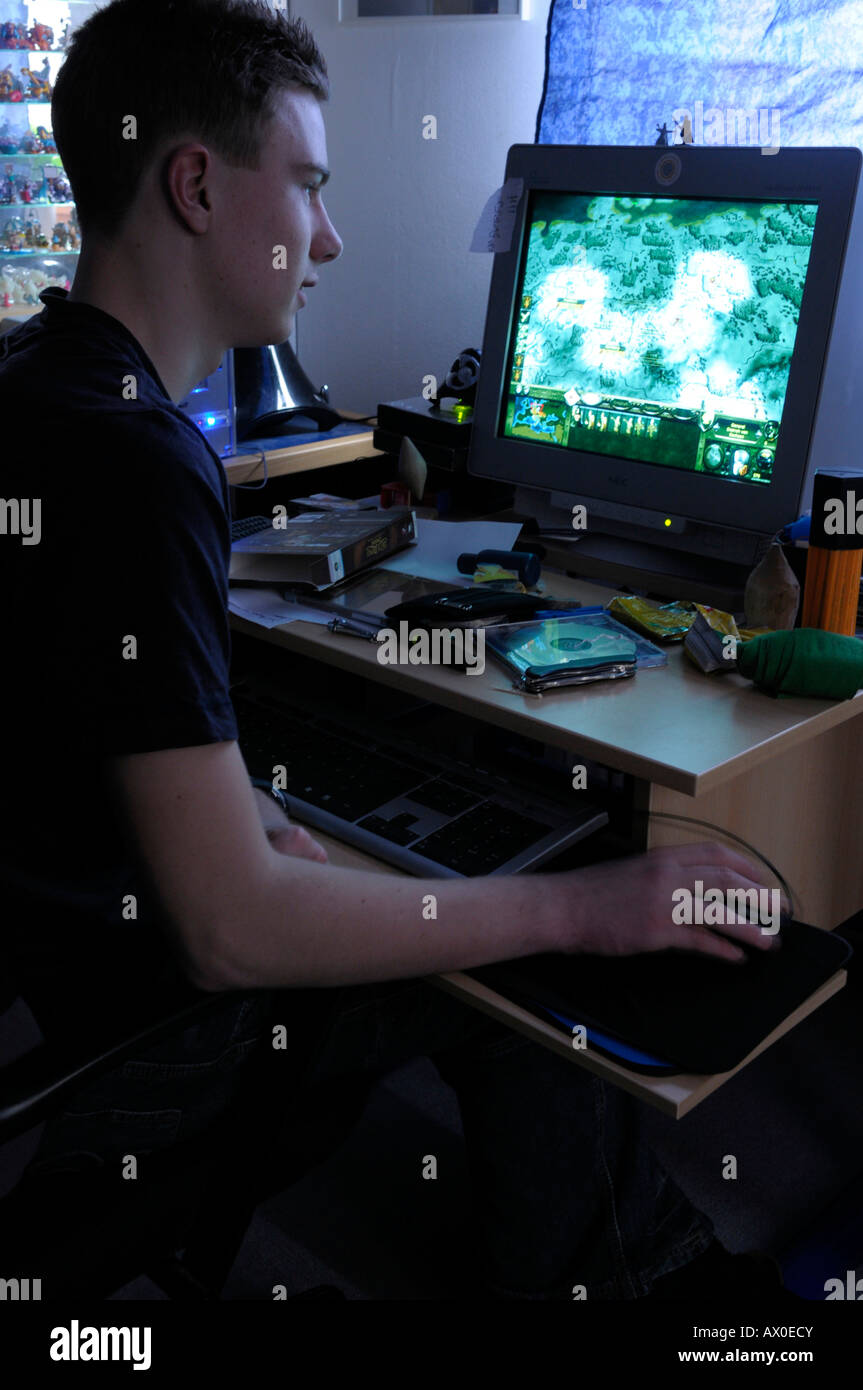 Teenager playing PC game on the computer Stock Photo - Alamy