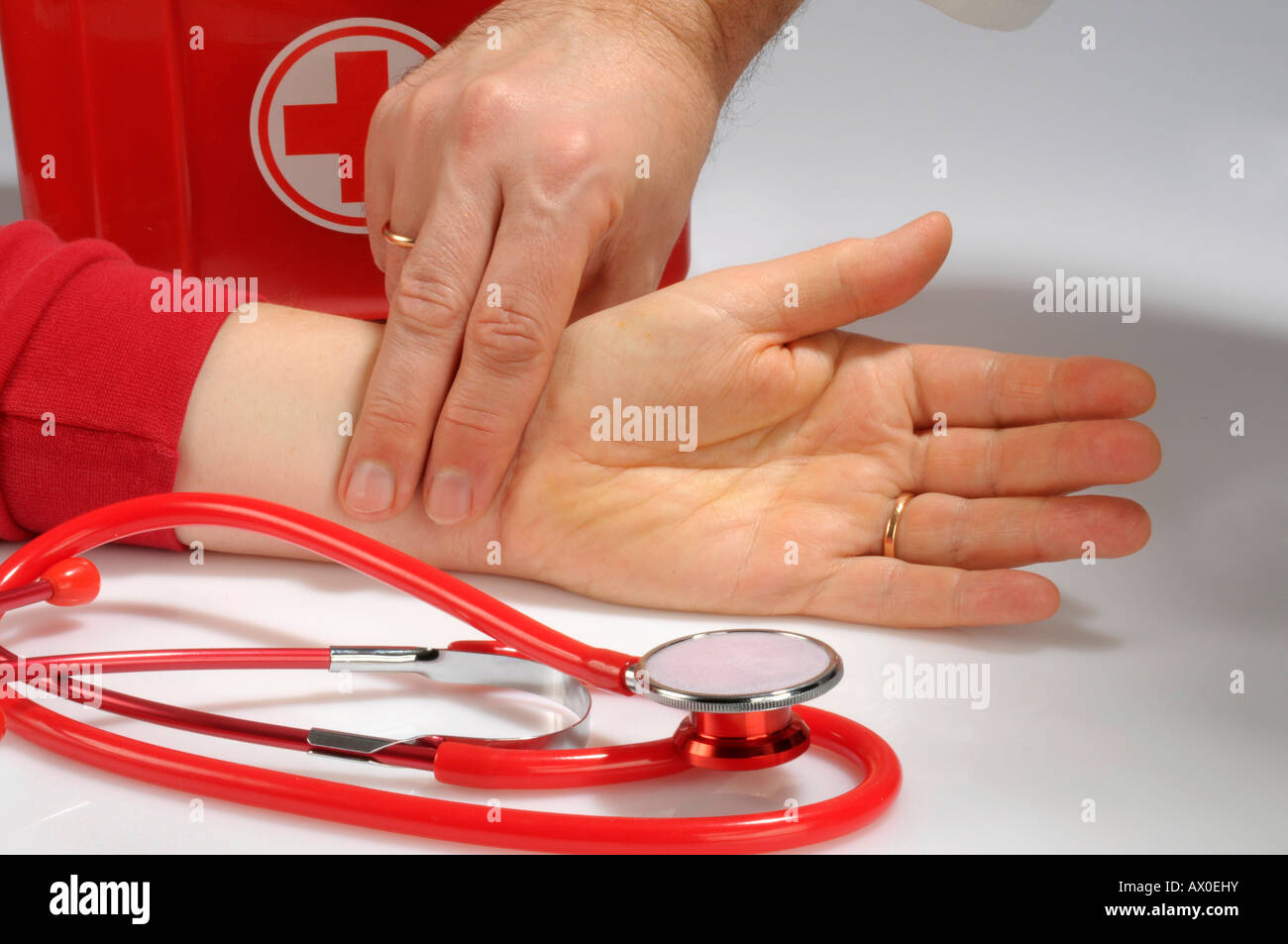 Doctor checking a patient's pulse Stock Photo - Alamy Doctor checking a patient's pulse Stock Photo - Alamy