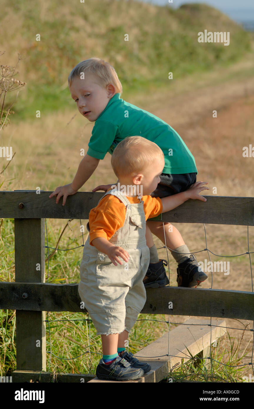 Two boys climbing stile Marloes Sands, Marloes Sands, Pembrokeshire ...