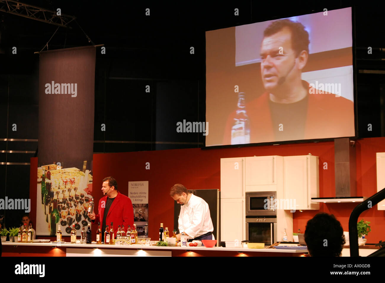 Professional chef at a fair and presenter live on big screen in Älvsjö ...