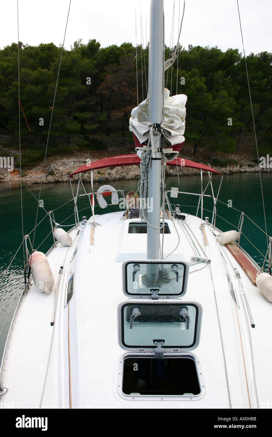 Lady looking through hatch on yacht Stock Photo - Alamy
