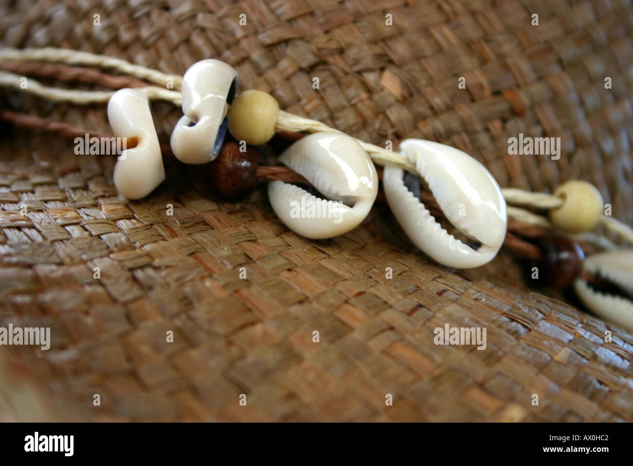 Shells on straw hat Stock Photo - Alamy