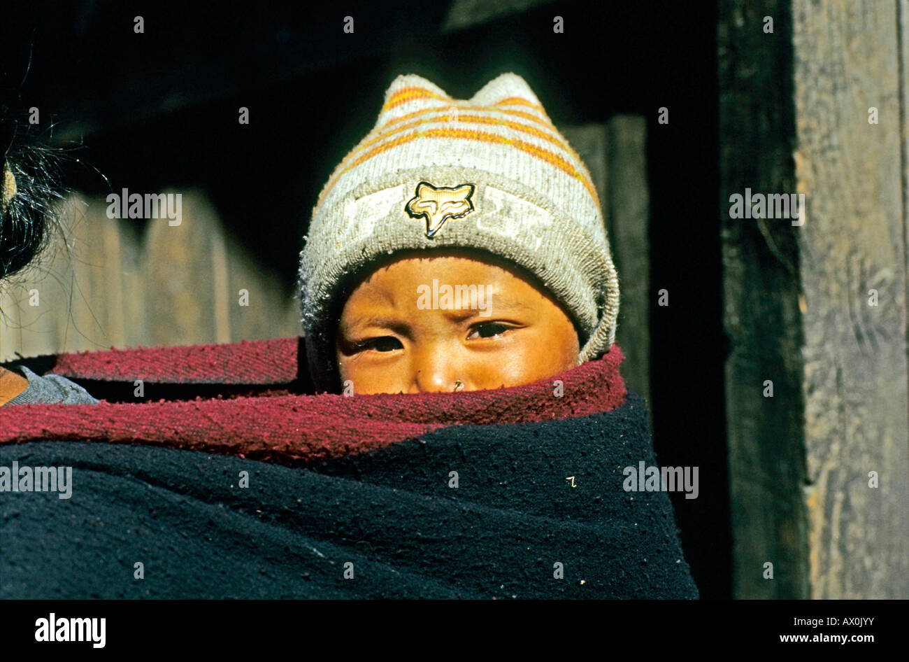 Child in sling, Annapurna district, Himalayas, Nepal, Asia Stock Photo ...