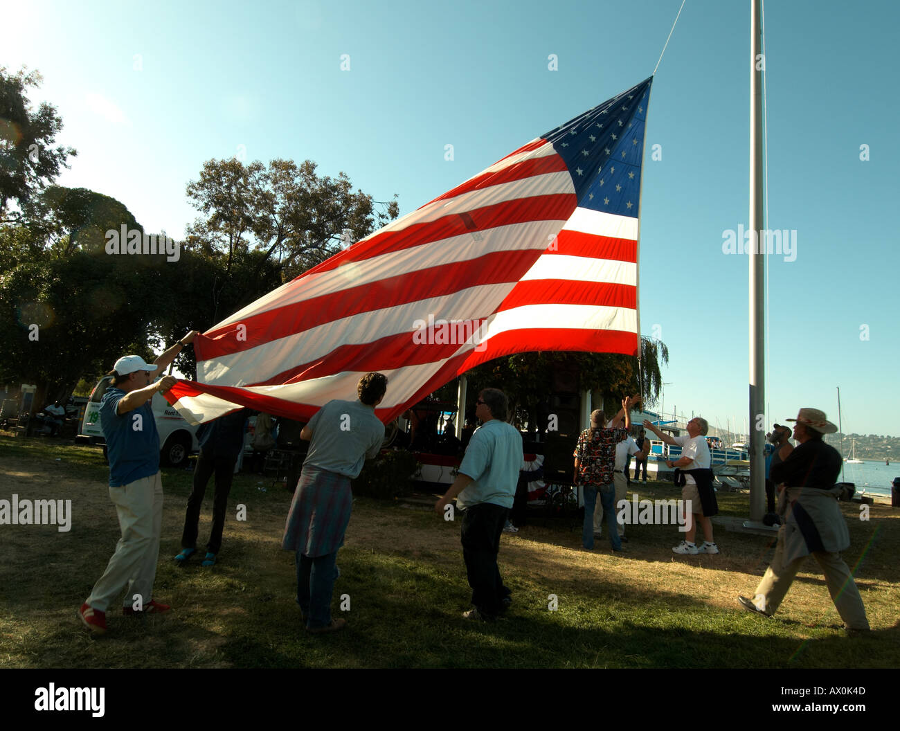 Lowering american flag sunset hi-res stock photography and images - Alamy