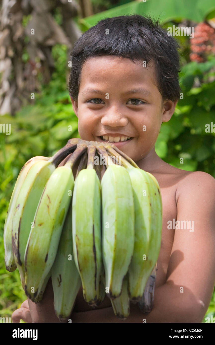 Child holding bananas, Pohnpei, Federated States of Micronesia Stock ...