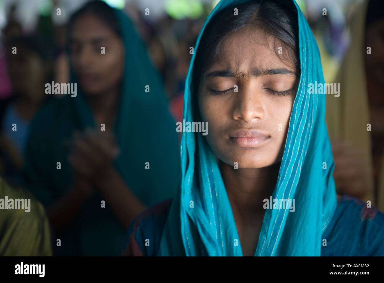 Young woman praying in a Christian church in Hyderabad India Stock ...