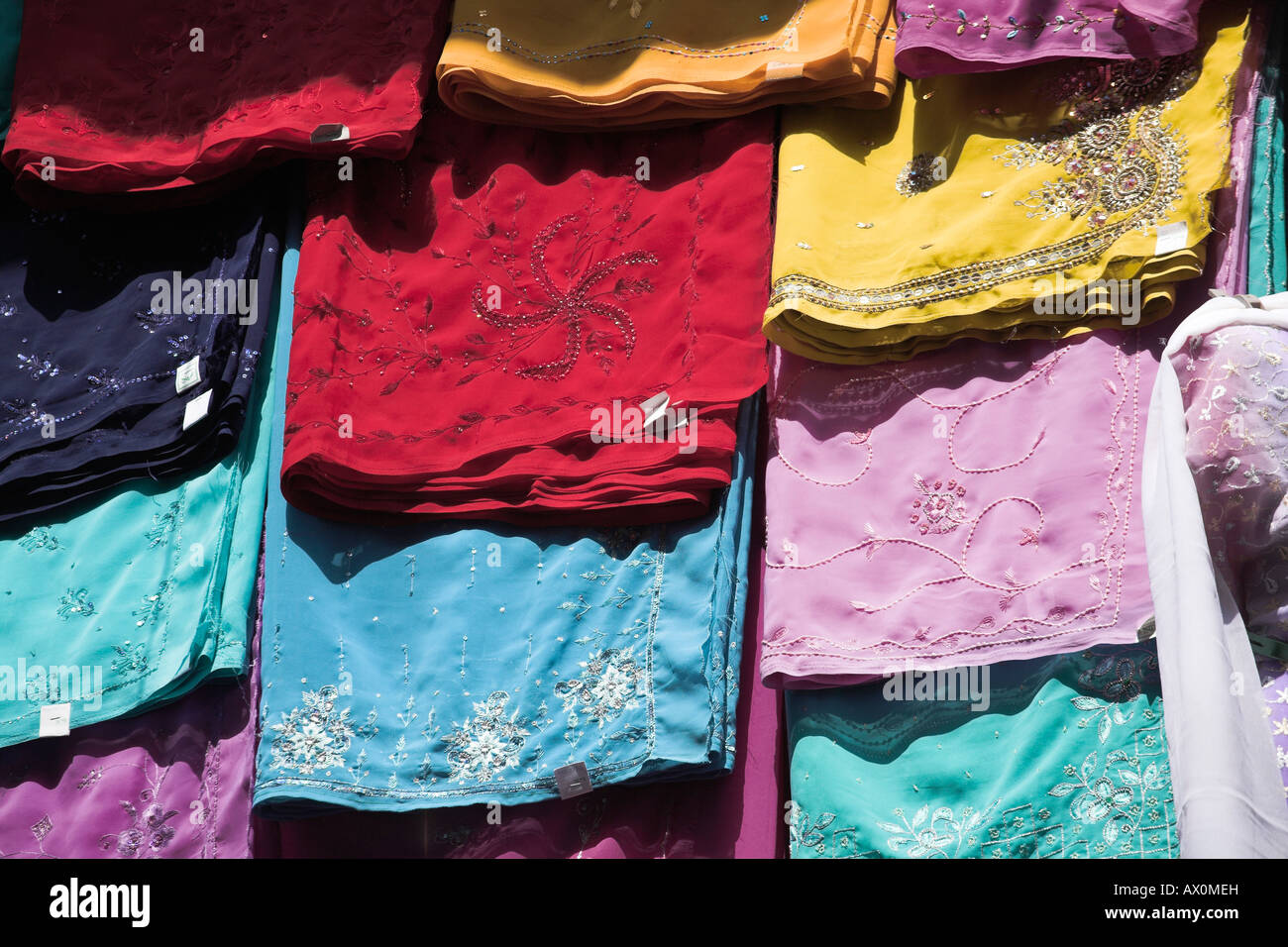 Nepal, Kathmandu, Colourful cloth hanging up outside shop Stock Photo ...