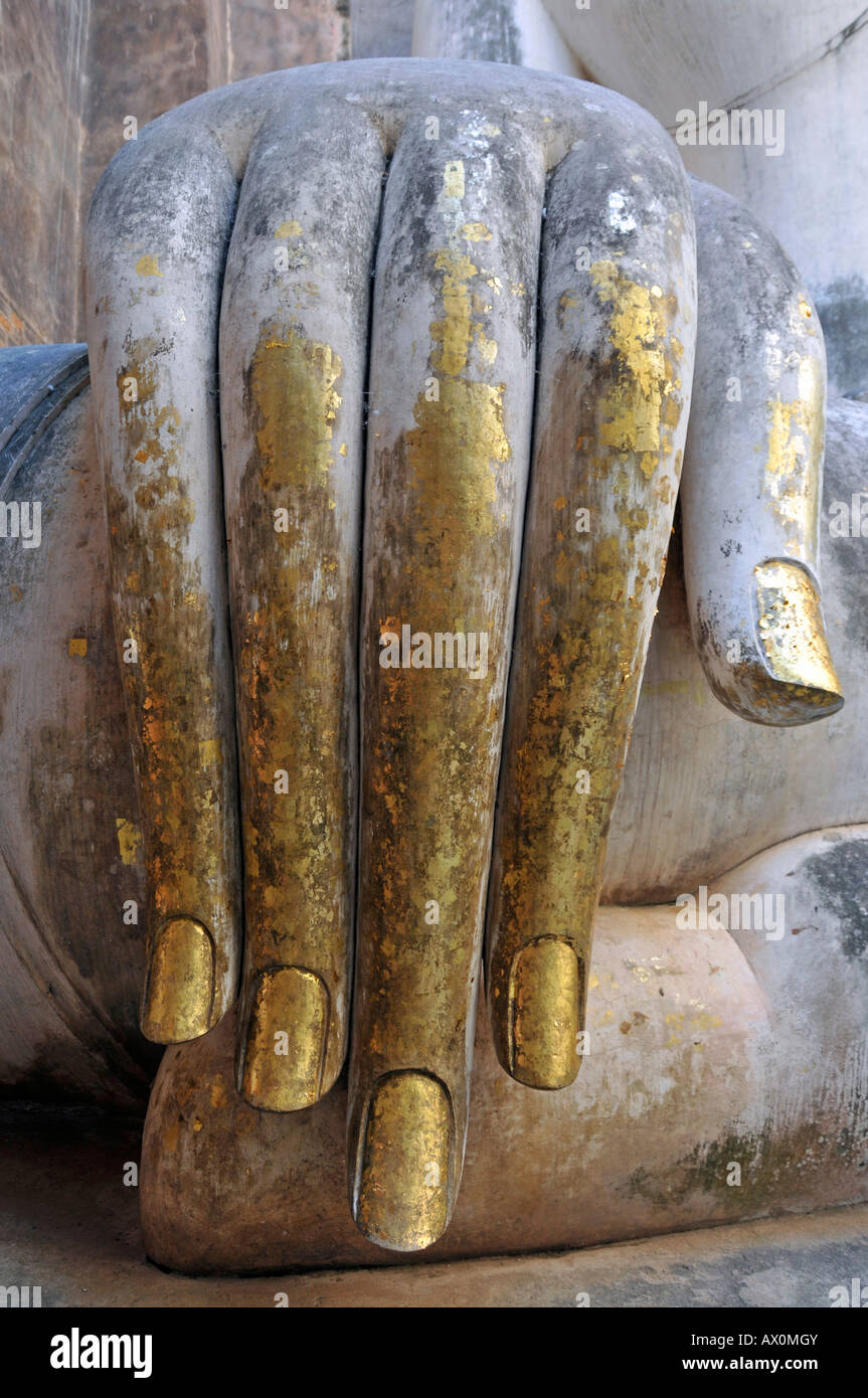 Gold leaf hand of a Buddha statue, Wat Si Chum, Sukhothai Historical ...