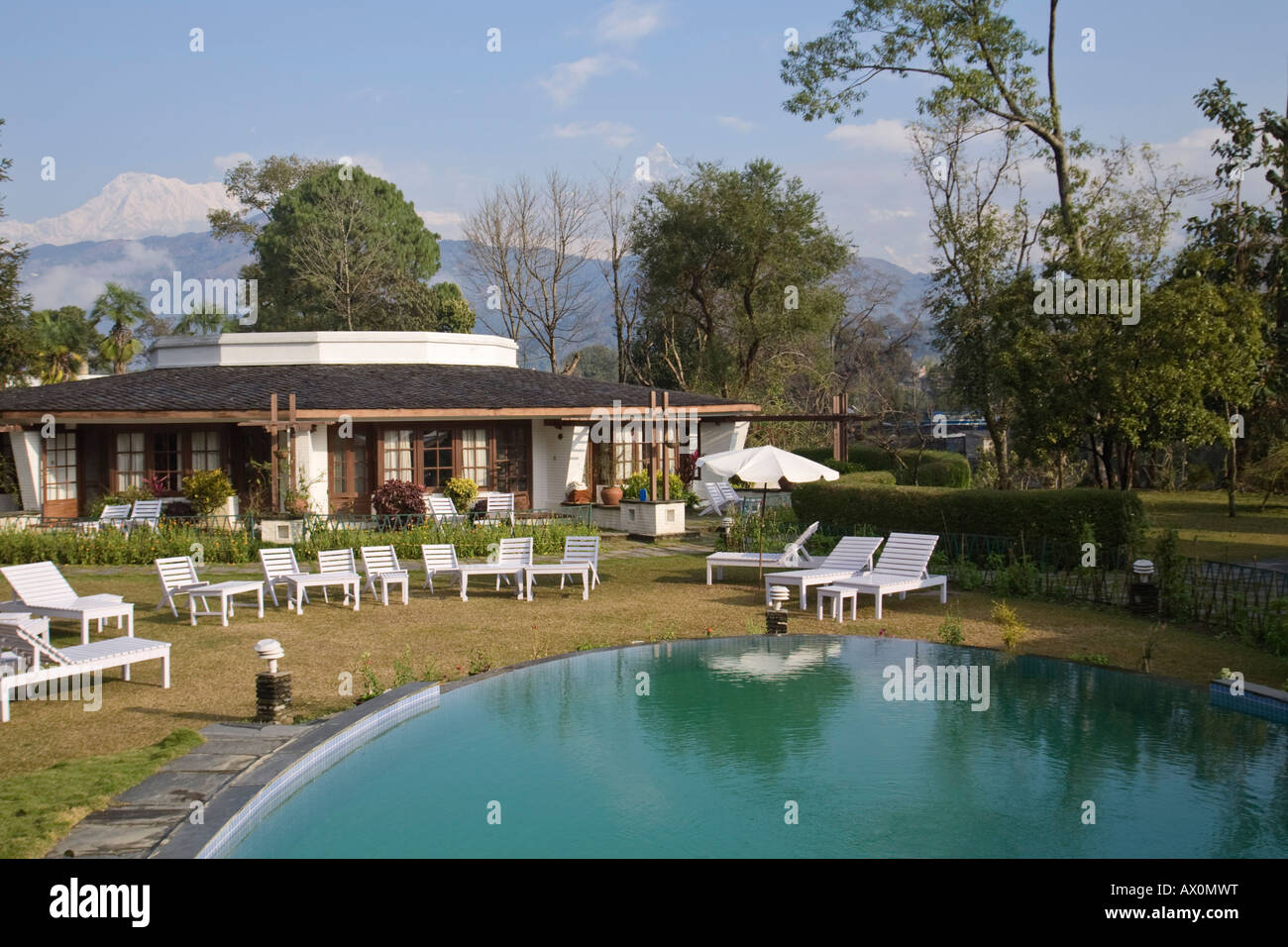 Nepal, Pokhara, Rooms and swimming pool at Fish Tail Lodge Stock Photo ...