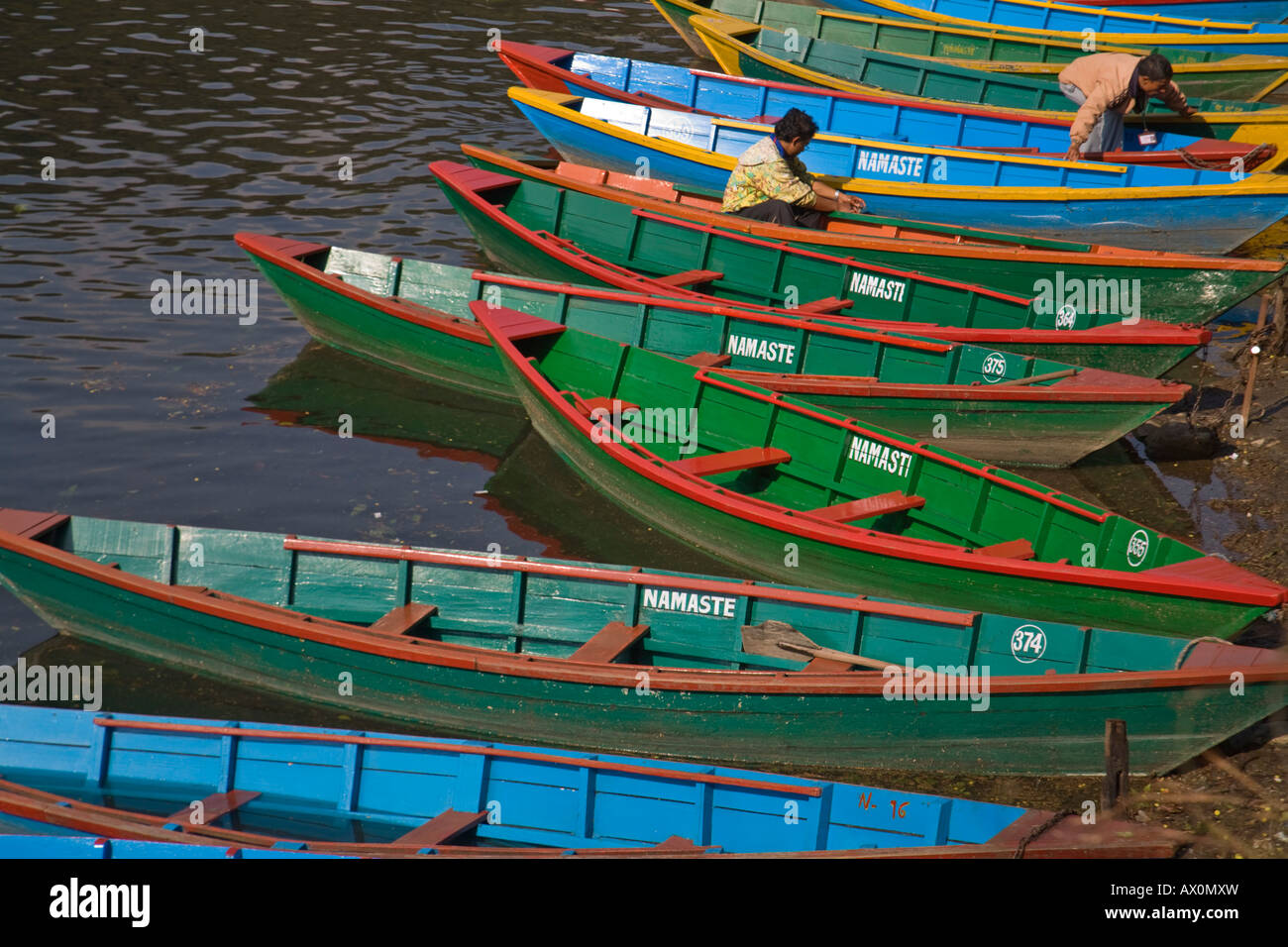 Nepal, Pokhara, Colourful canoes on Phewa Lake Stock Photo - Alamy