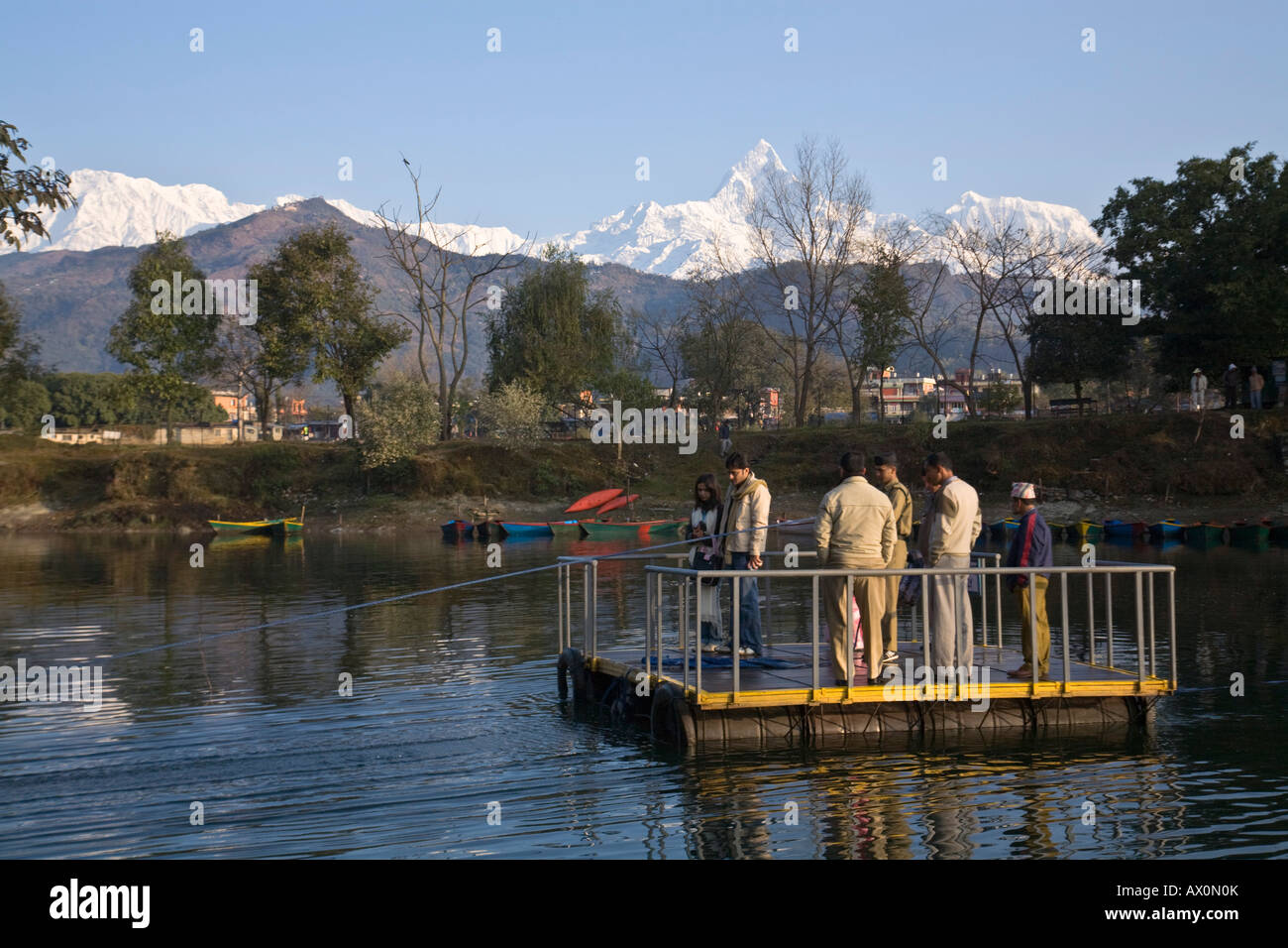 Nepal, Pokhara, Tourists in pontoon crossing Phewa Lake to Fish Tail ...