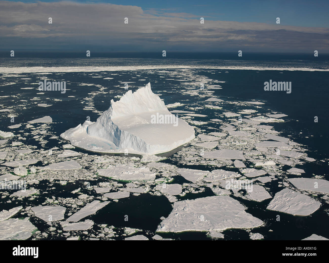 Iceberg and chunks of floating ice off the coast of Franklin Island ...