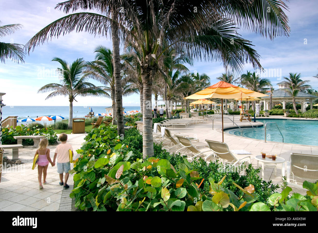Children walk by one of the four pools at Breakers Hotel, Palm Beach ...