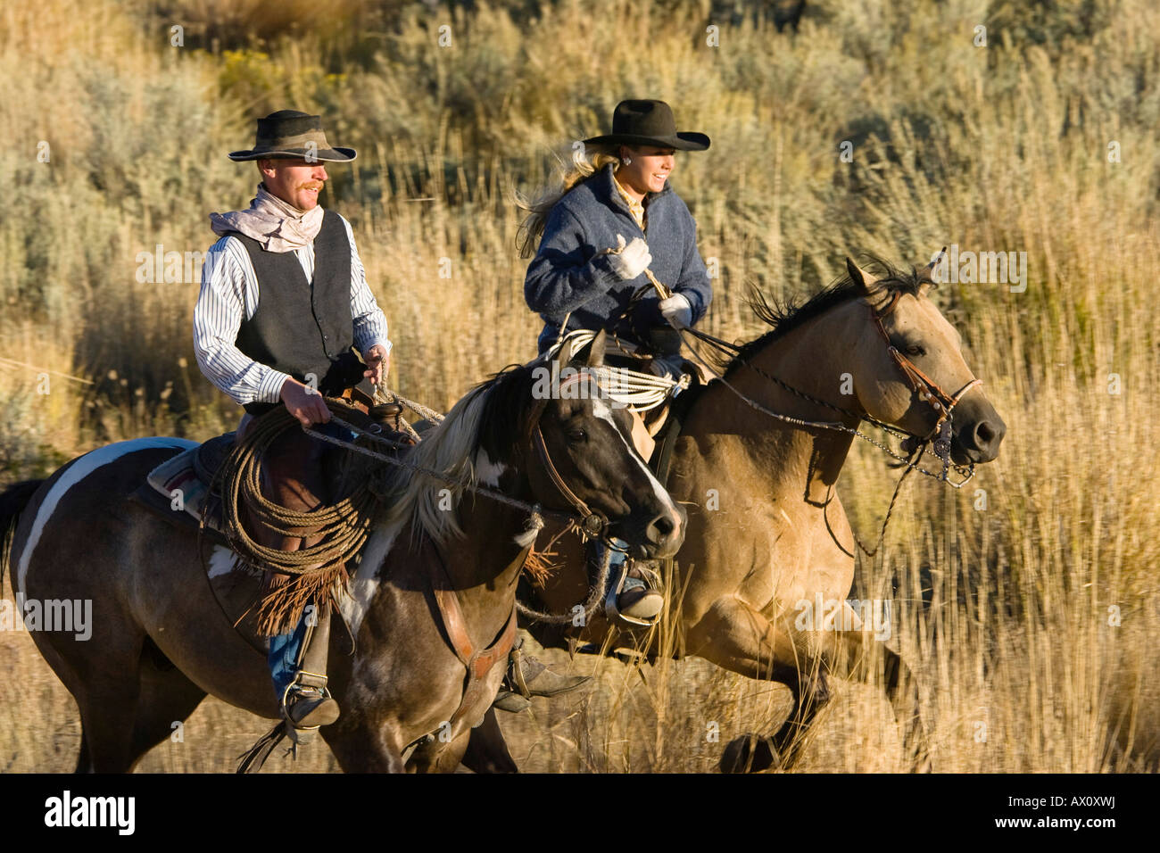Cowgirl and cowboy riding, Oregon, USA Stock Photo - Alamy