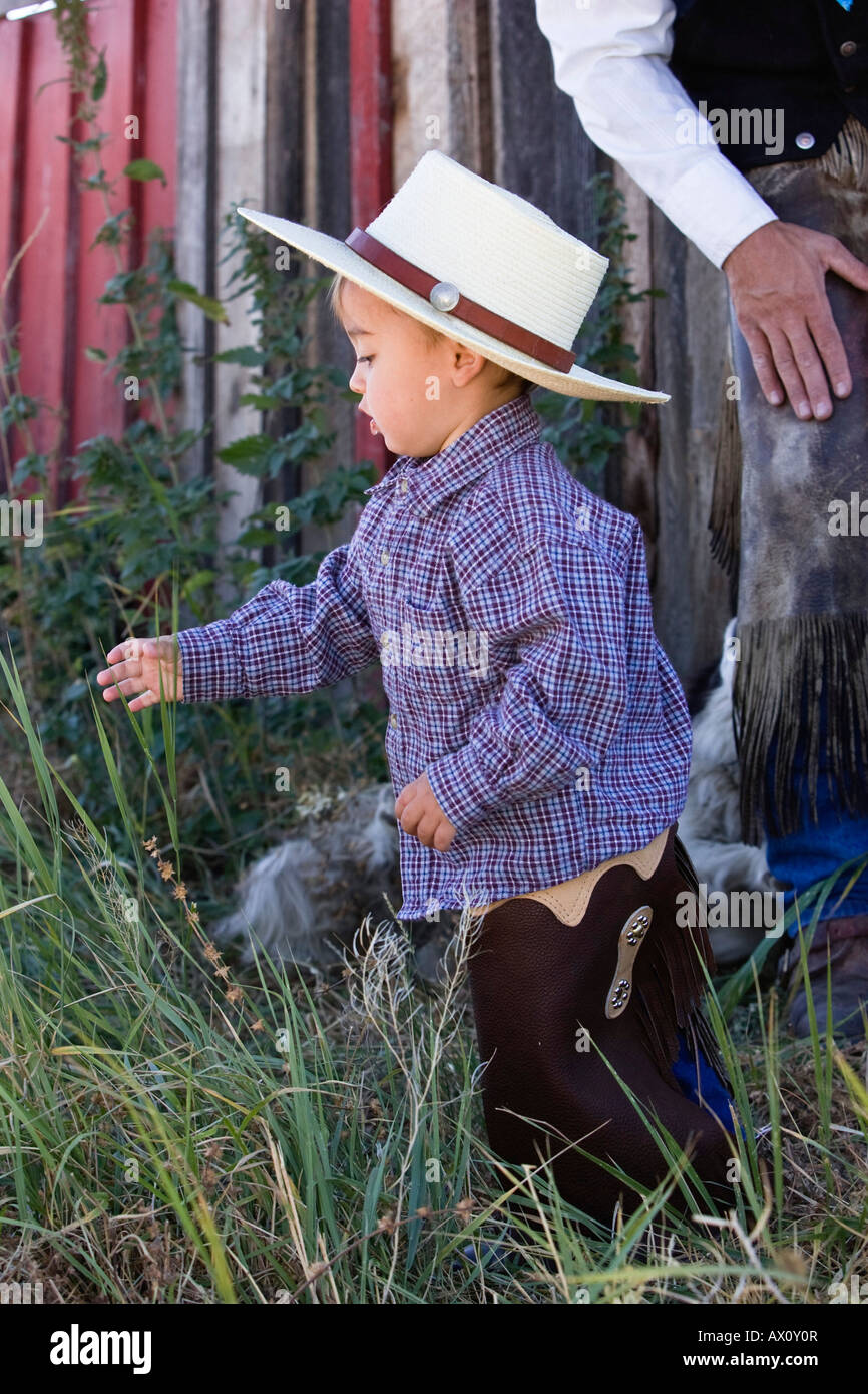 Cowboy child at barn, wildwest, Oregon, USA Stock Photo - Alamy