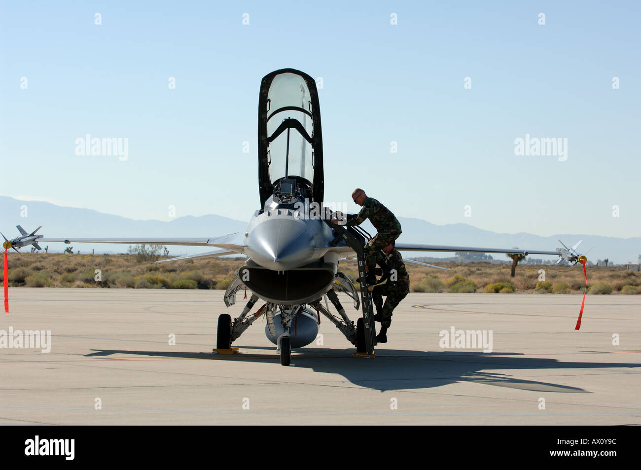 Fighter jet pilot climbing ladder of F-16 aircraft at Edwards Air Force ...