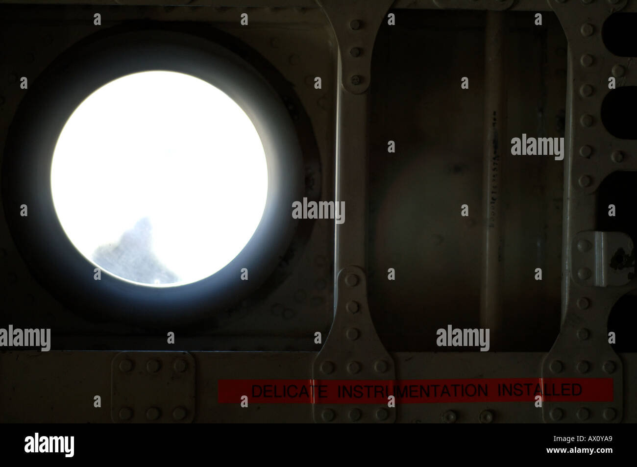 View through cargo military airplane window Stock Photo - Alamy