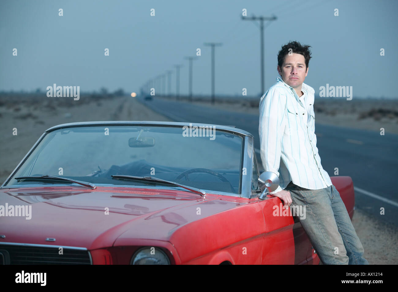 Man standing next to sports car hi-res stock photography and images - Alamy