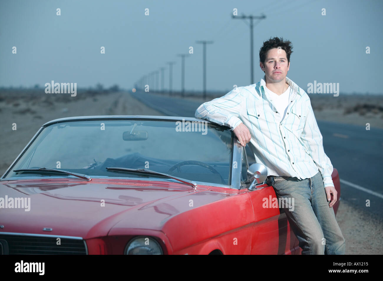 Man standing next to sports car hi-res stock photography and images - Alamy