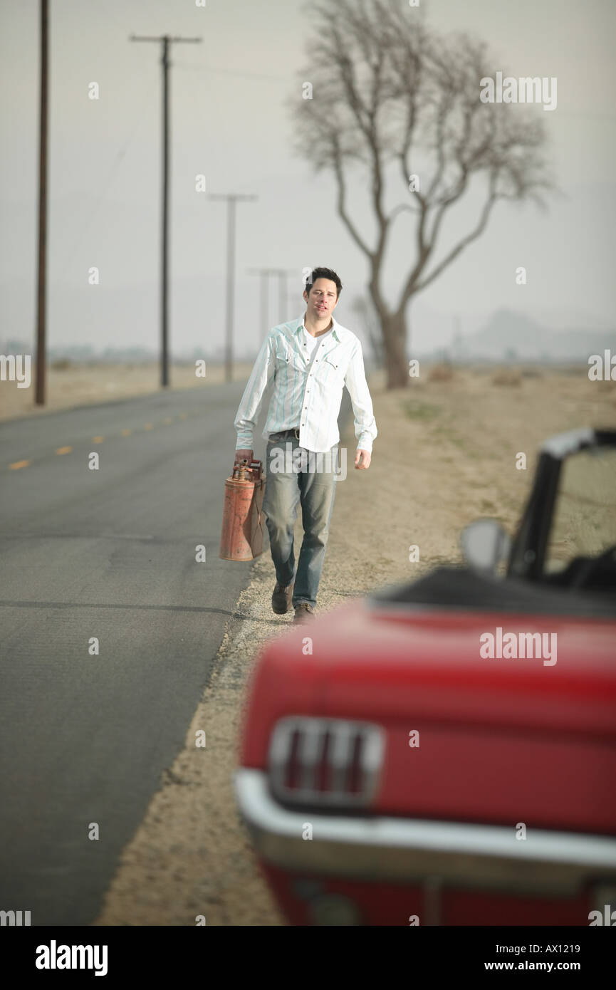 Man walking gas can hi-res stock photography and images - Alamy
