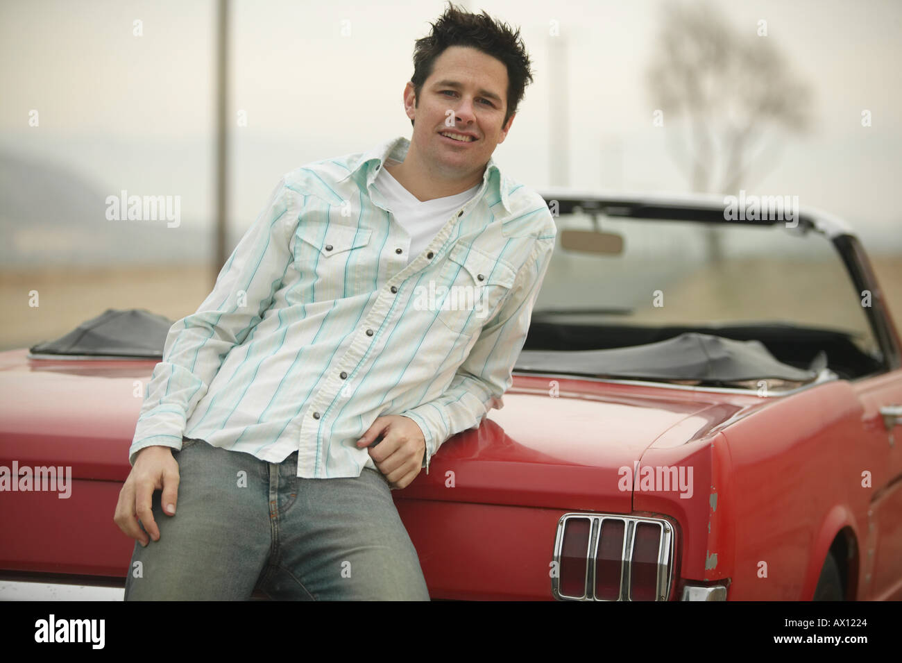 Man standing next to sports car hi-res stock photography and images - Alamy