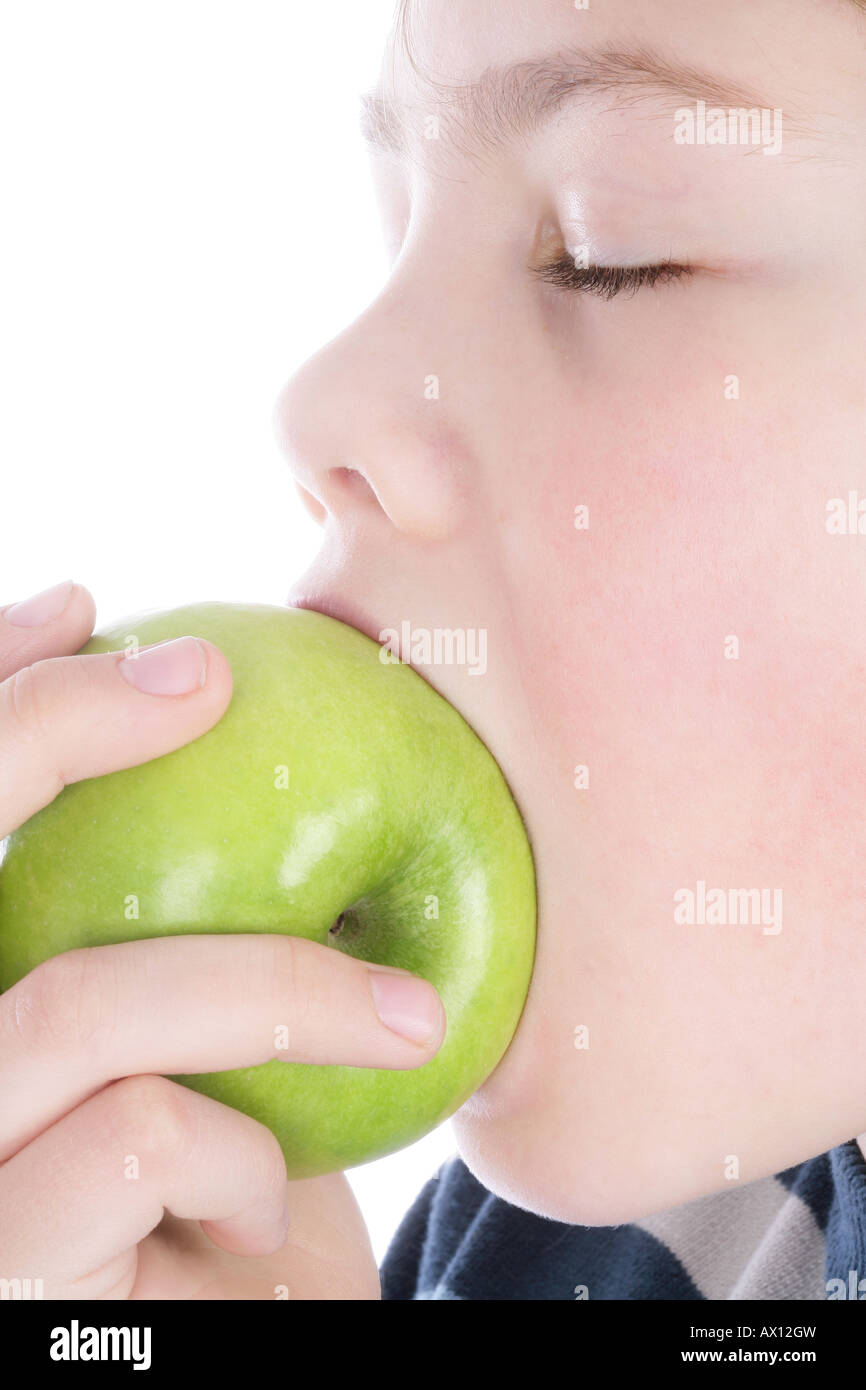Young Boy Eating an Apple Stock Photo - Alamy