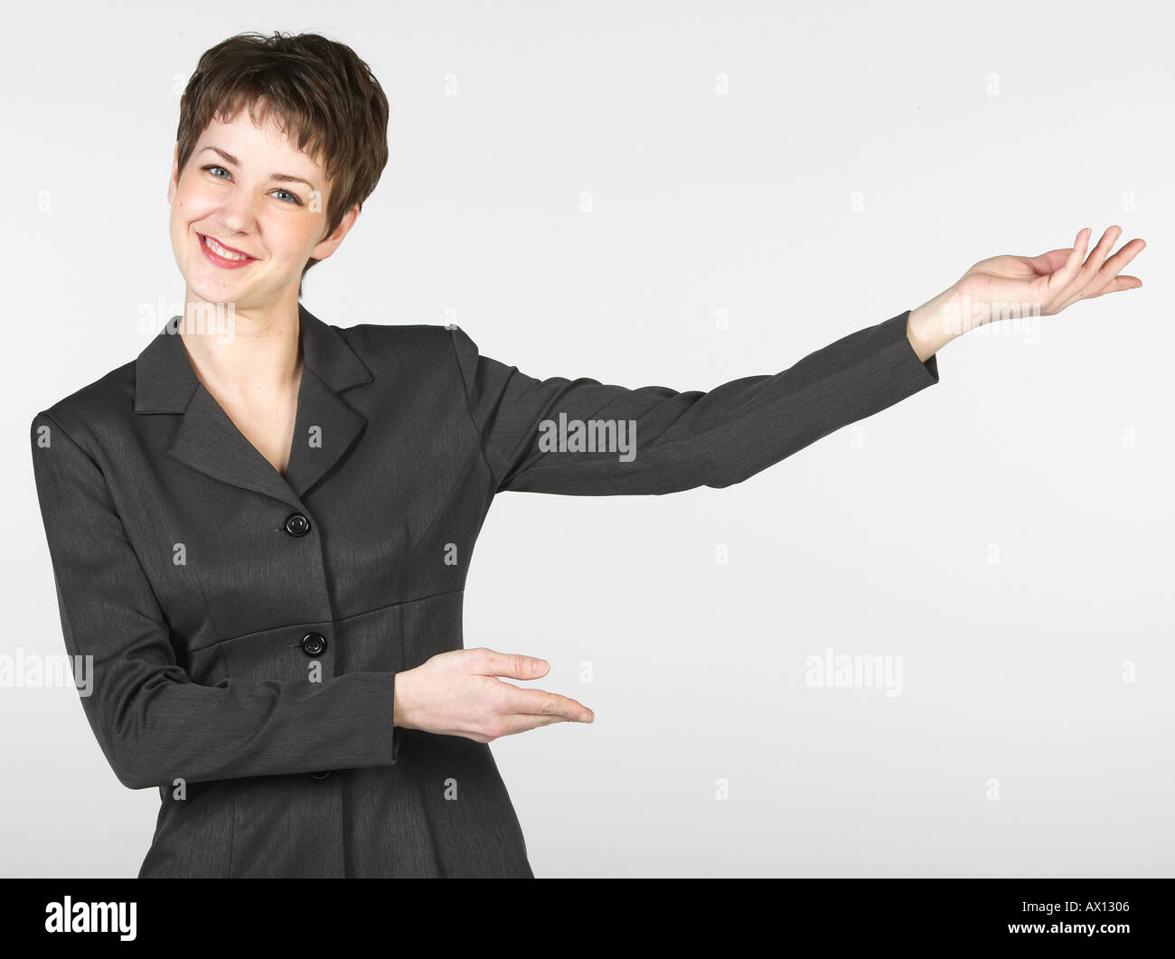 Smiling businesswoman giving presentation Stock Photo - Alamy