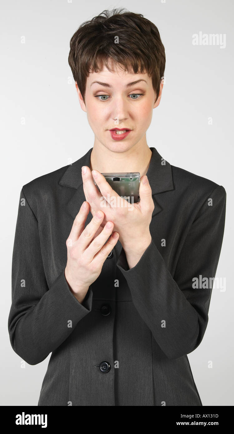 Surprised businesswoman holding PDA Stock Photo - Alamy Surprised businesswoman holding PDA Stock Photo - Alamy