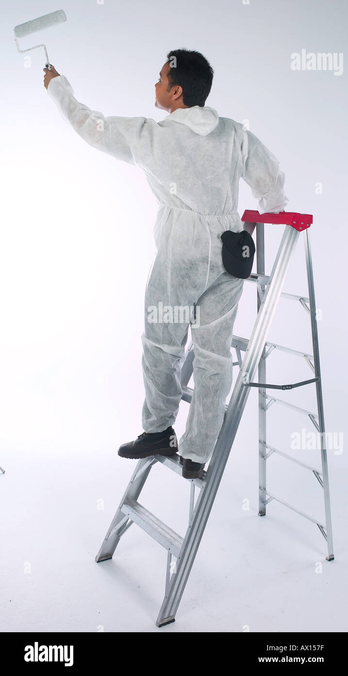 Painter on ladder painting a81 Stock Photo - Alamy