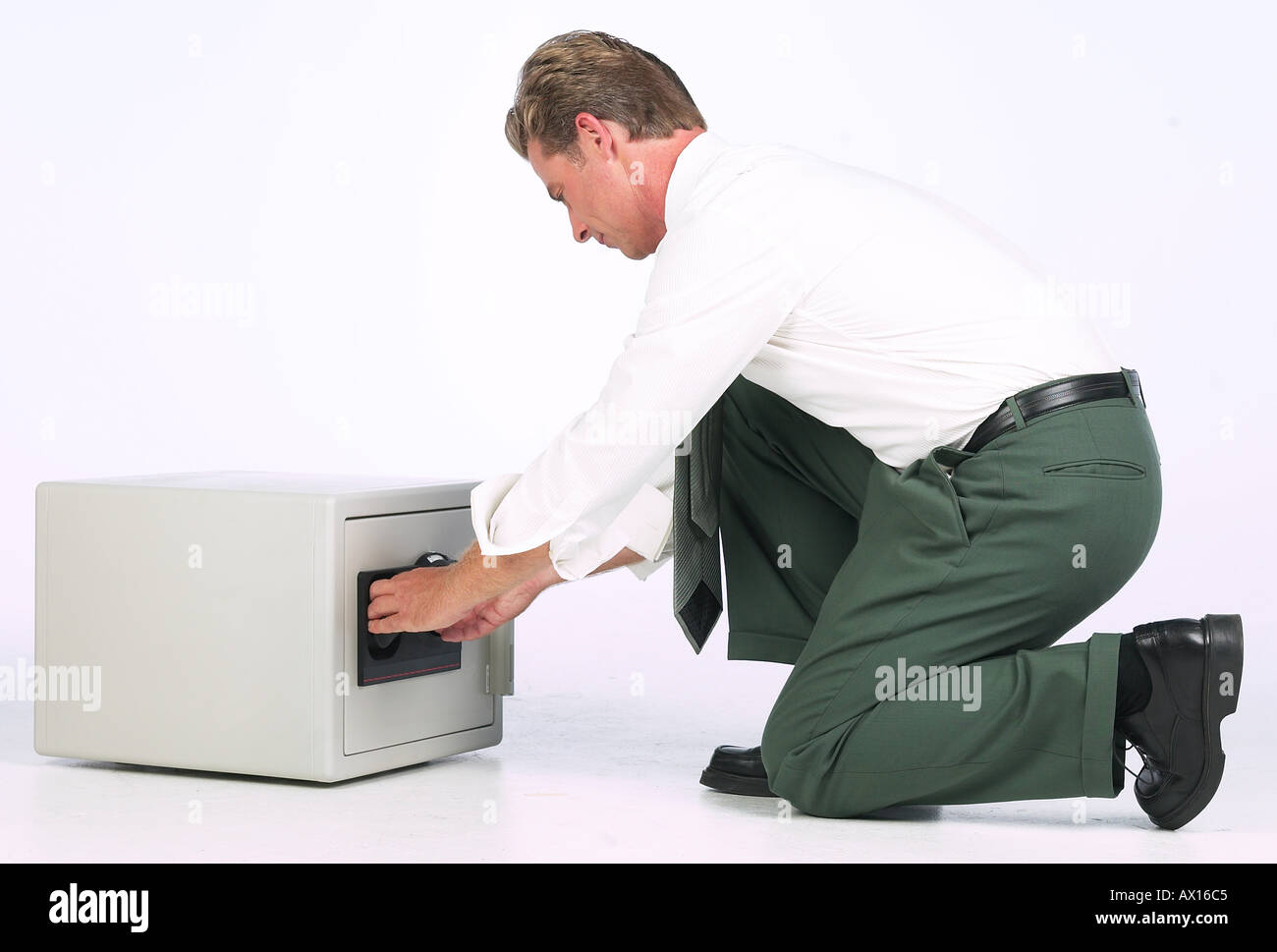 Man money opening safe hi-res stock photography and images - Alamy