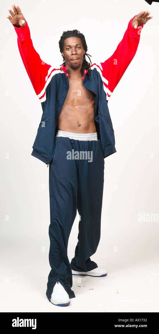 Man in athletic wear reaching out his arms Stock Photo - Alamy