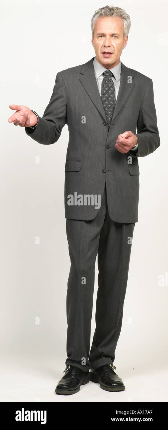 Businessman in black suit making a presentation Stock Photo - Alamy
