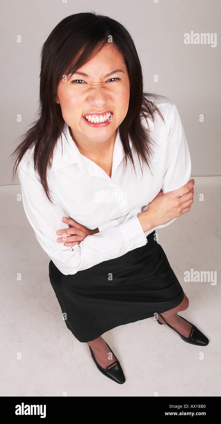 Young Asian business woman making a disgusted face Stock Photo - Alamy