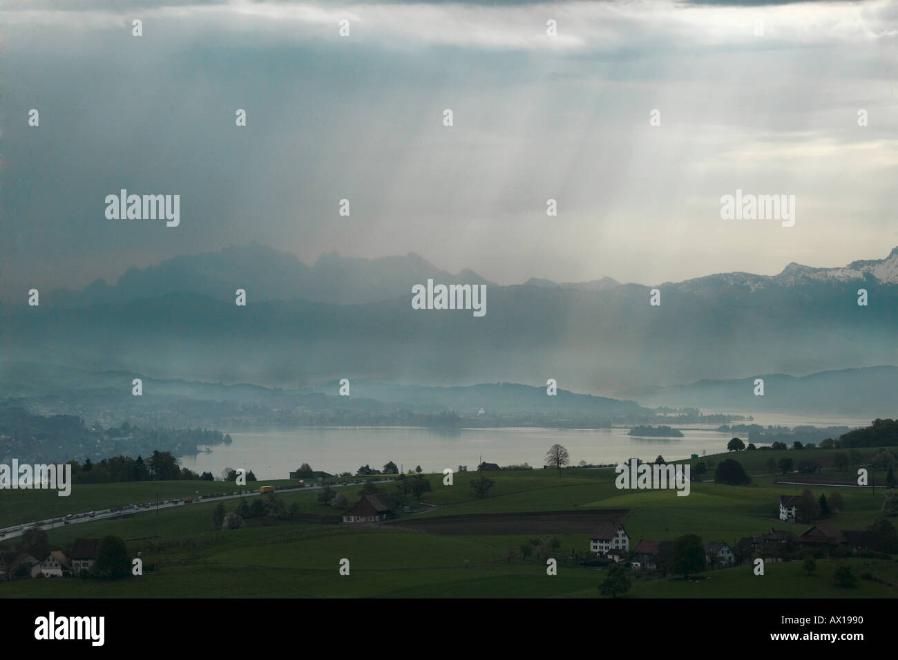 Rain falling on countryside Stock Photo - Alamy