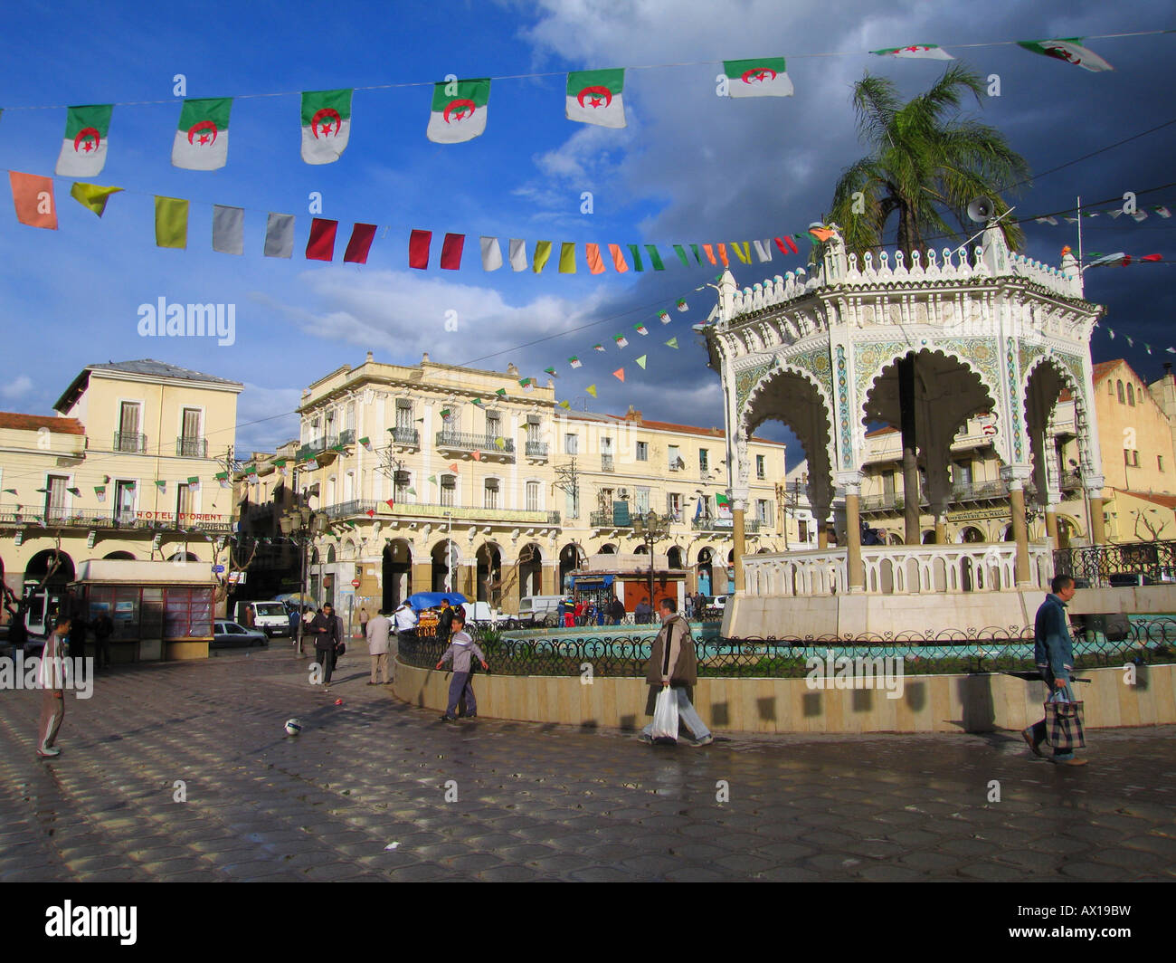Old square and buildings from the french period, Central place of palm ...