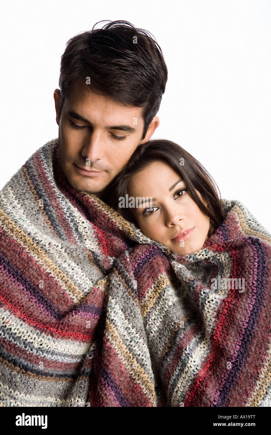A couple wrapped in a blanket Stock Photo - Alamy