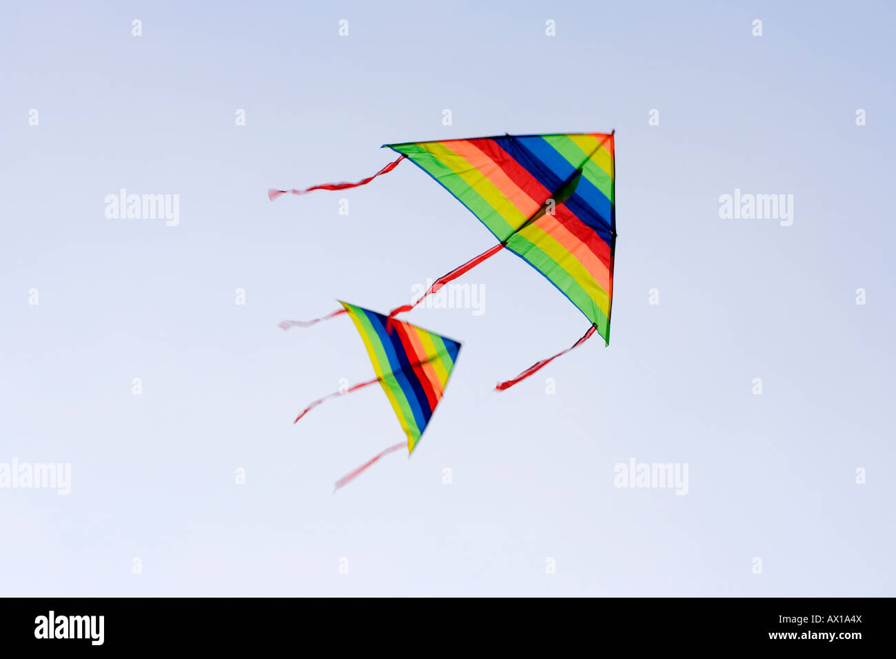 Two colorful kites flying Stock Photo - Alamy