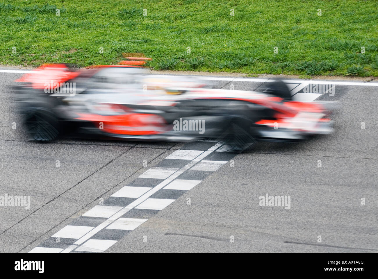 Lewis Hamilton, Mc Laren Mercedes crosses the finish line in a speedy ...