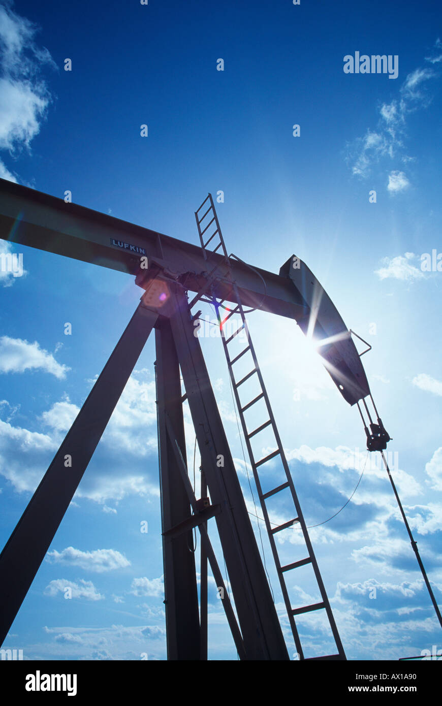 Back lit oil derrick Stock Photo - Alamy
