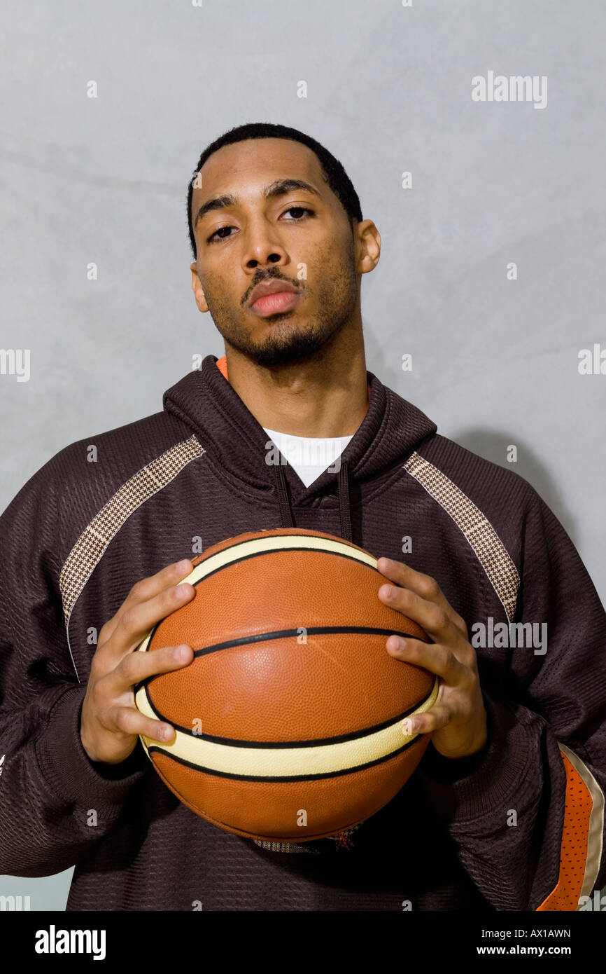 Basketball in the hands hi-res stock photography and images - Alamy