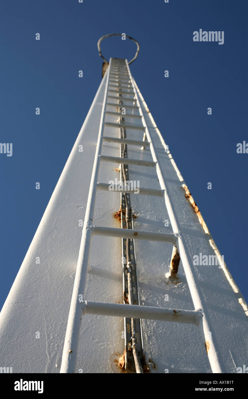 Ladder with blue sky background Stock Photo - Alamy