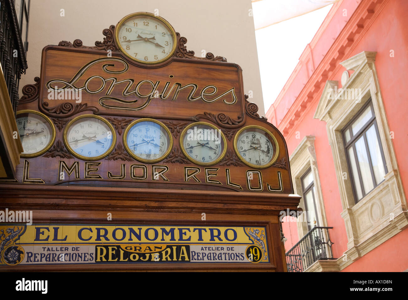 Clock shop "El Cronomentro, " facade featuring clocks showing various ...