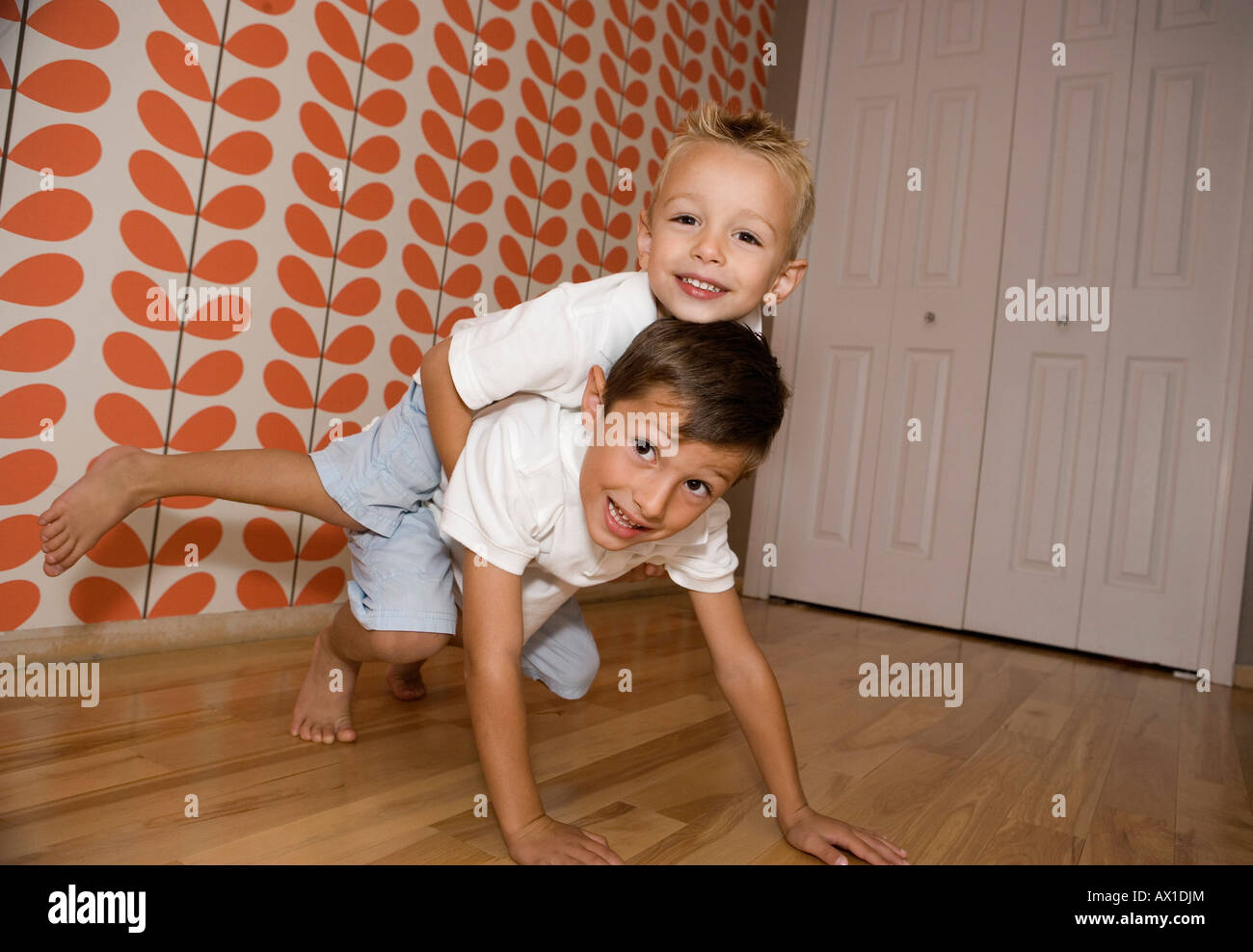 Two Young Boys Rough Housing Stock Photo - Alamy