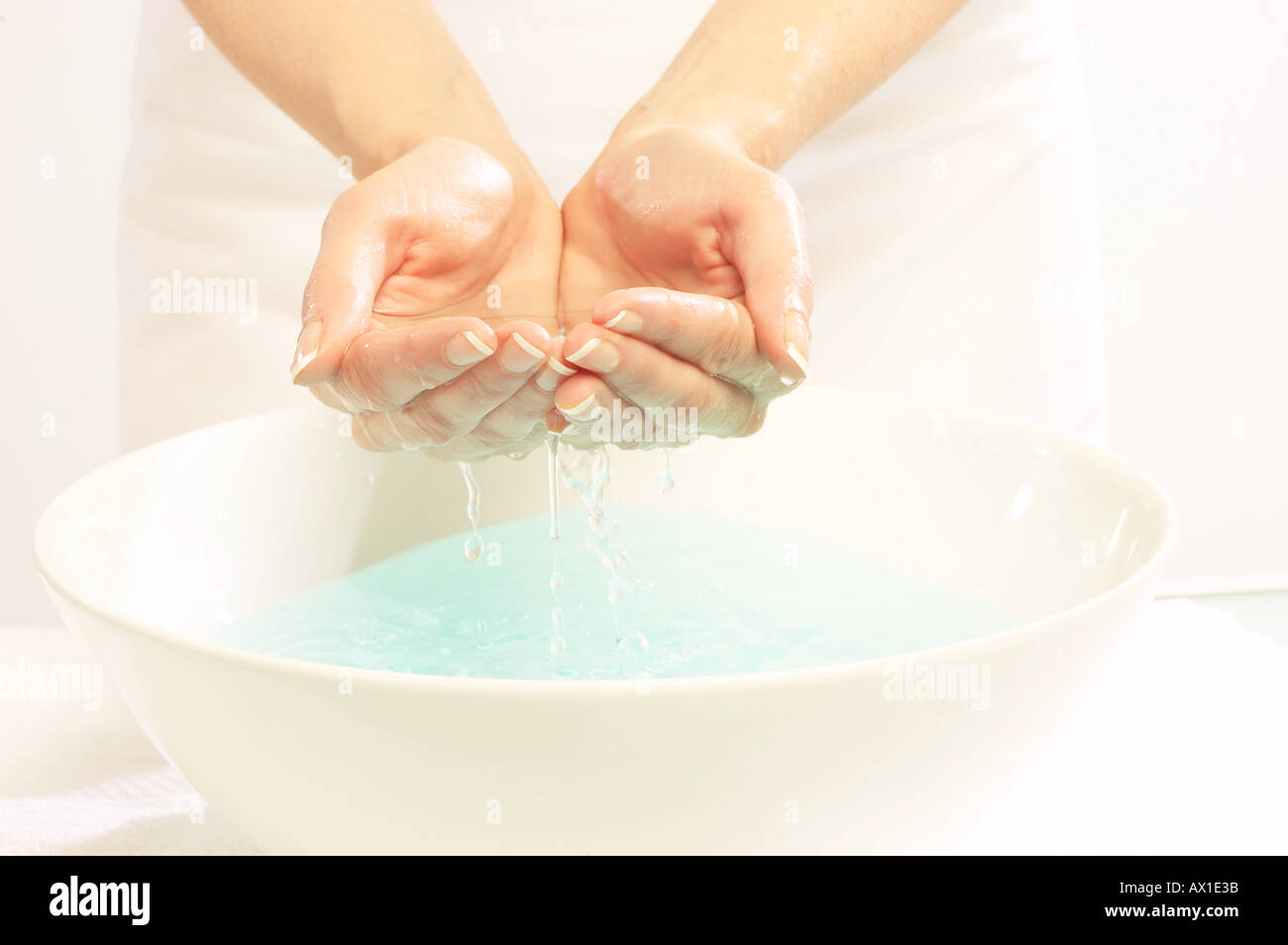 Person washing their face in basin 1 Stock Photo - Alamy