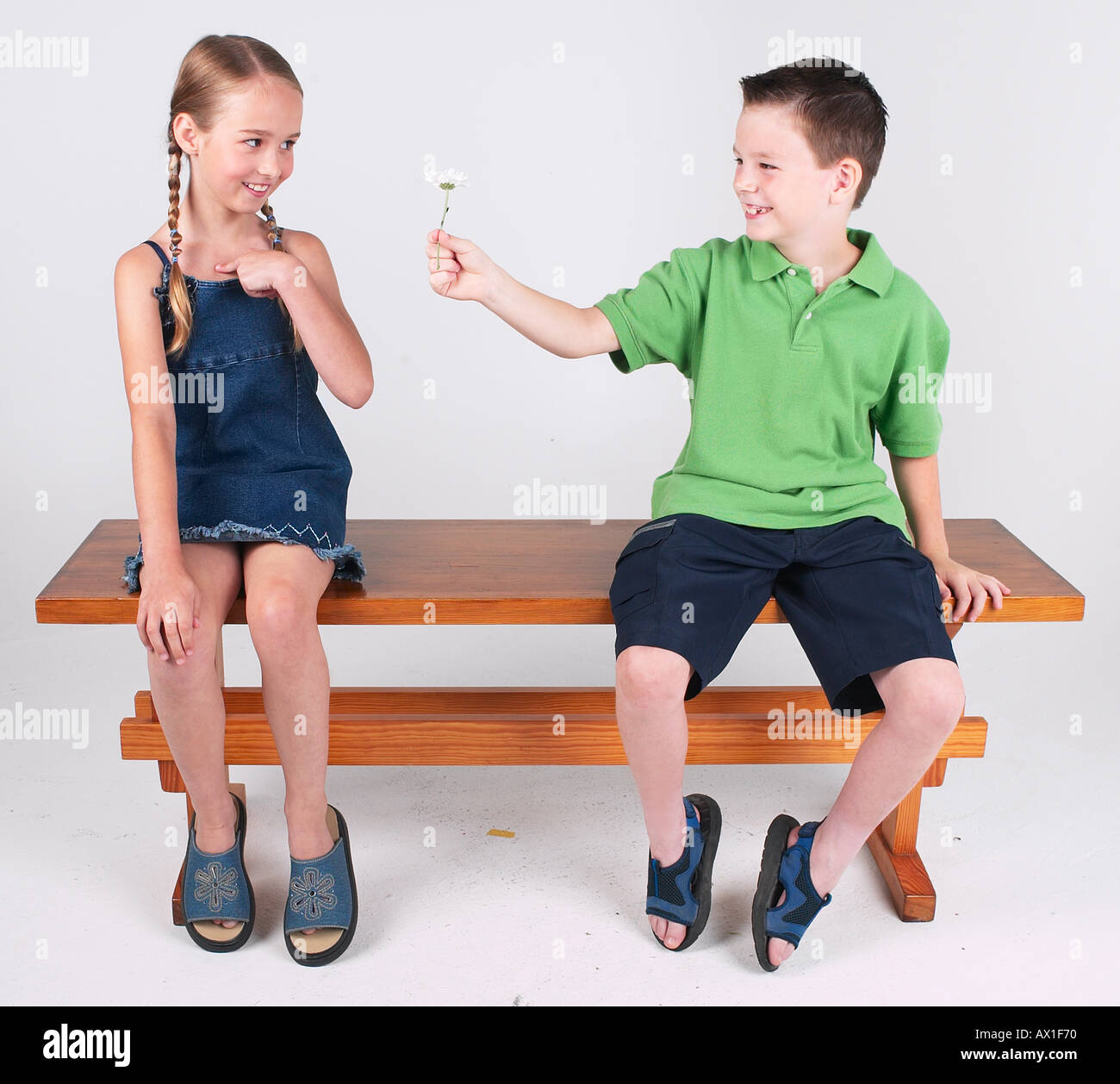 Boy giving flower girl hi-res stock photography and images - Alamy