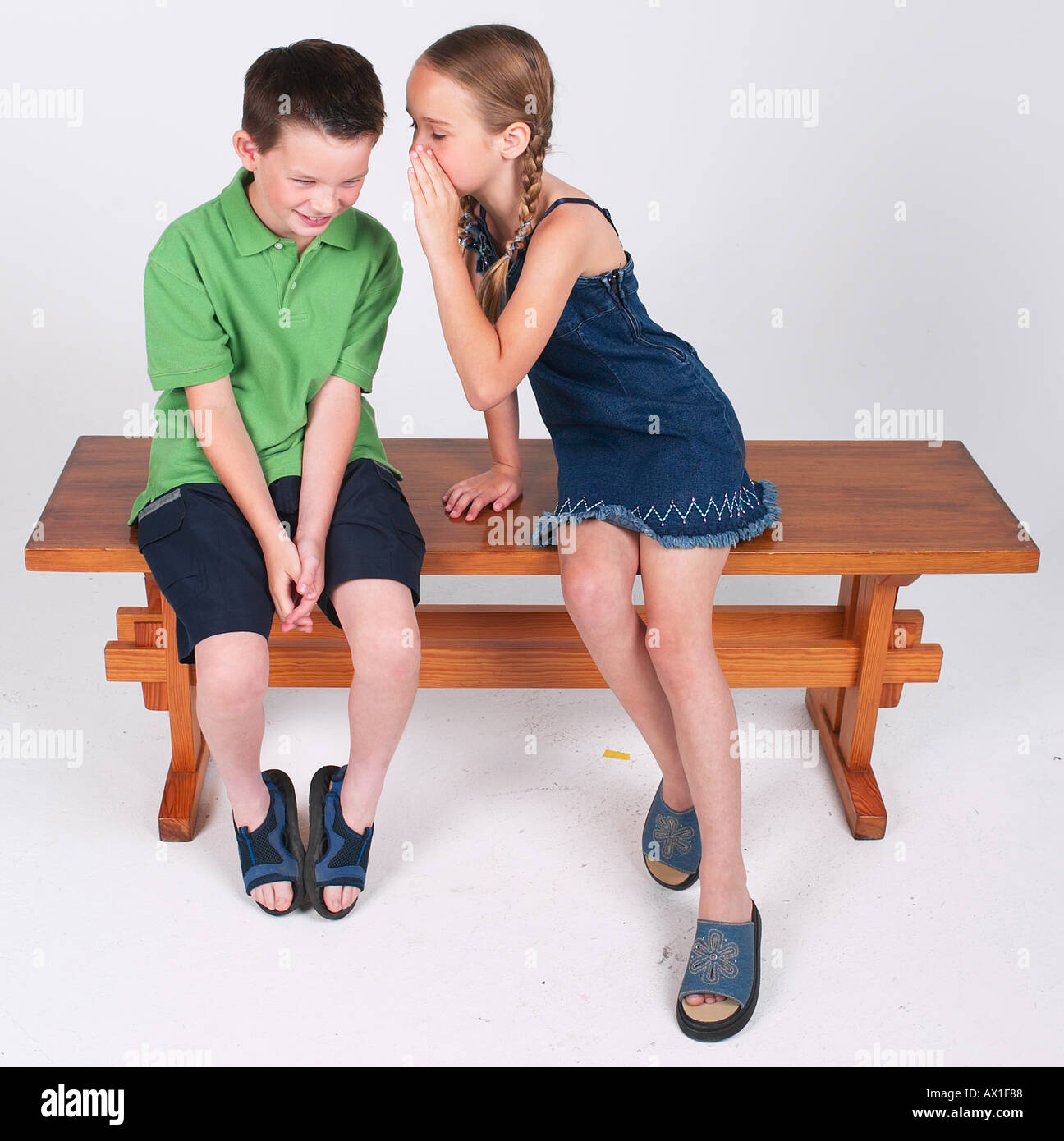 Children telling secrets hi-res stock photography and images - Alamy