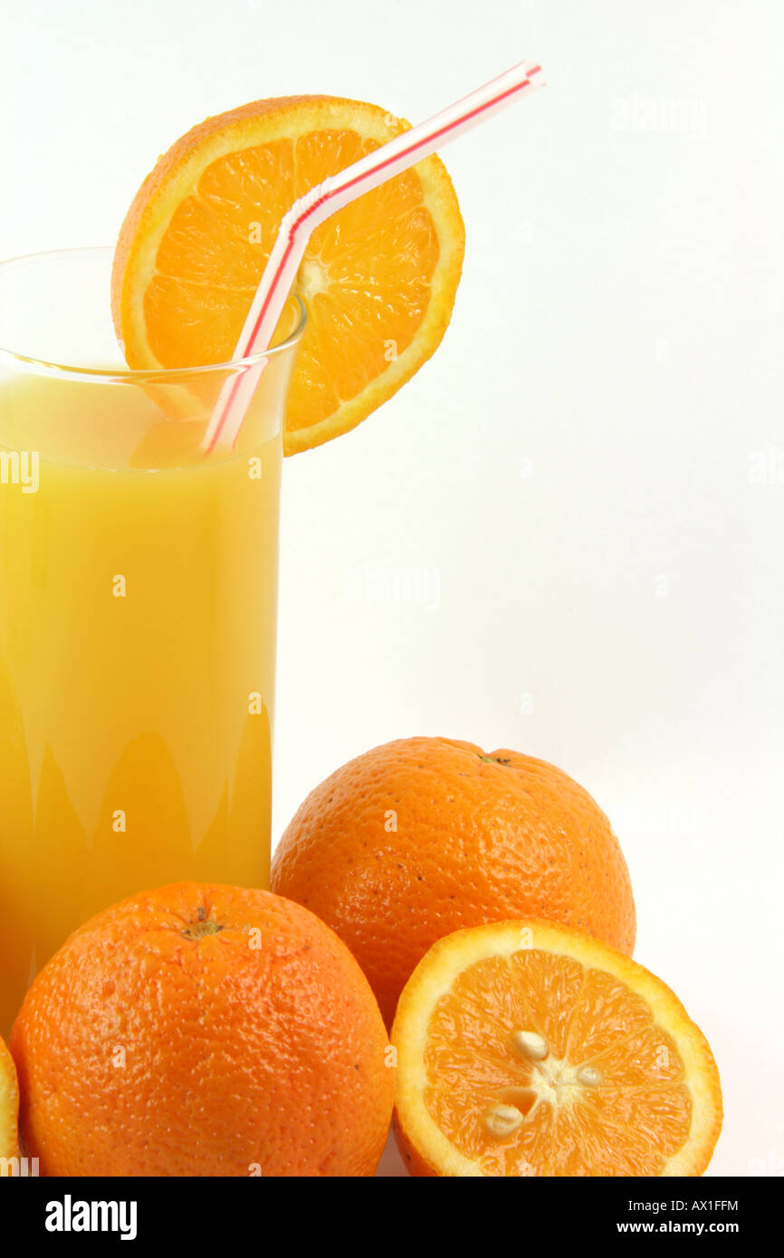 healthy eating glass of orange juice with straw and slice of orange ...