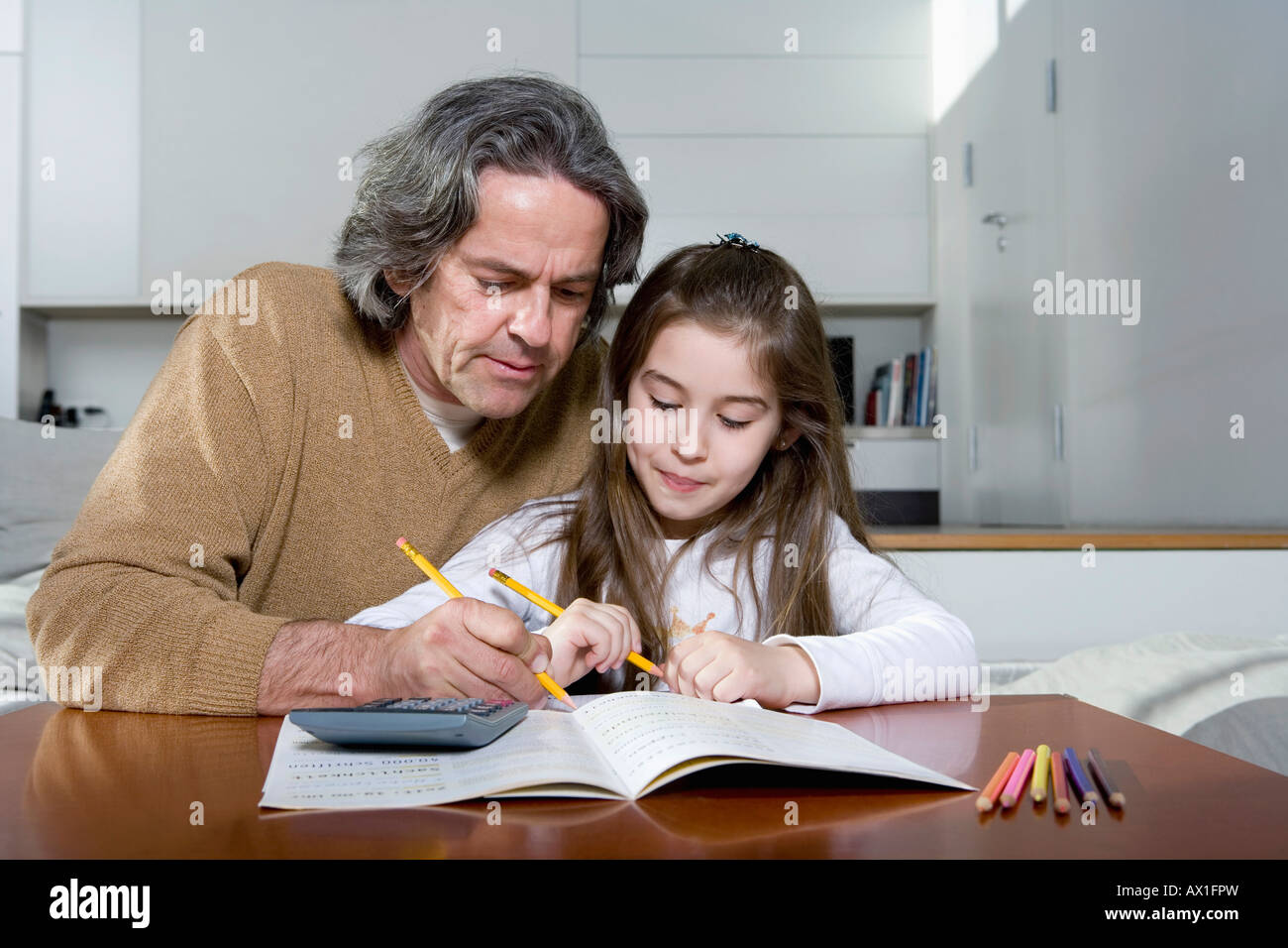 Parent helping child math homework hi-res stock photography and images ...