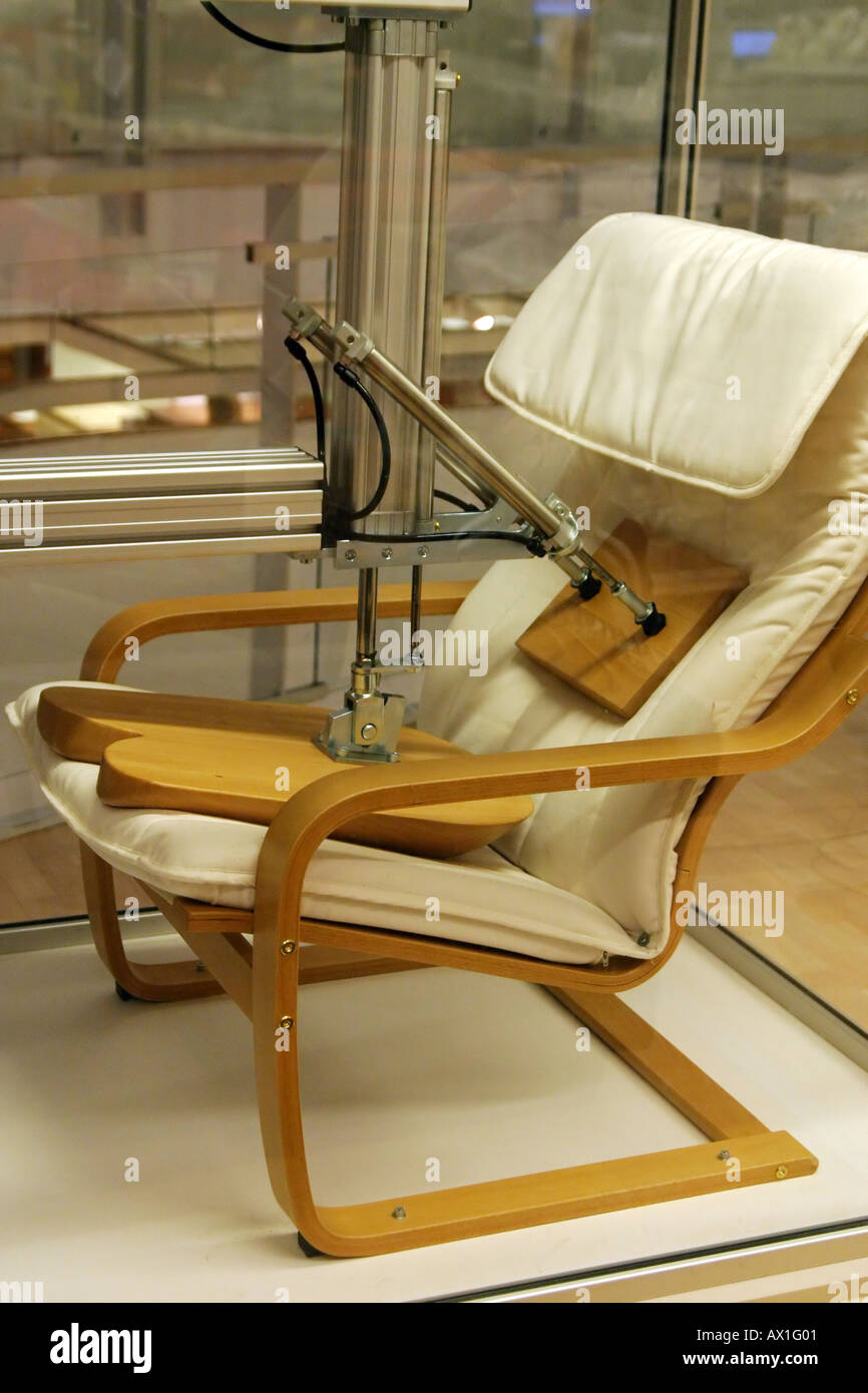 Machine used to test the stamina of furniture Stock Photo - Alamy