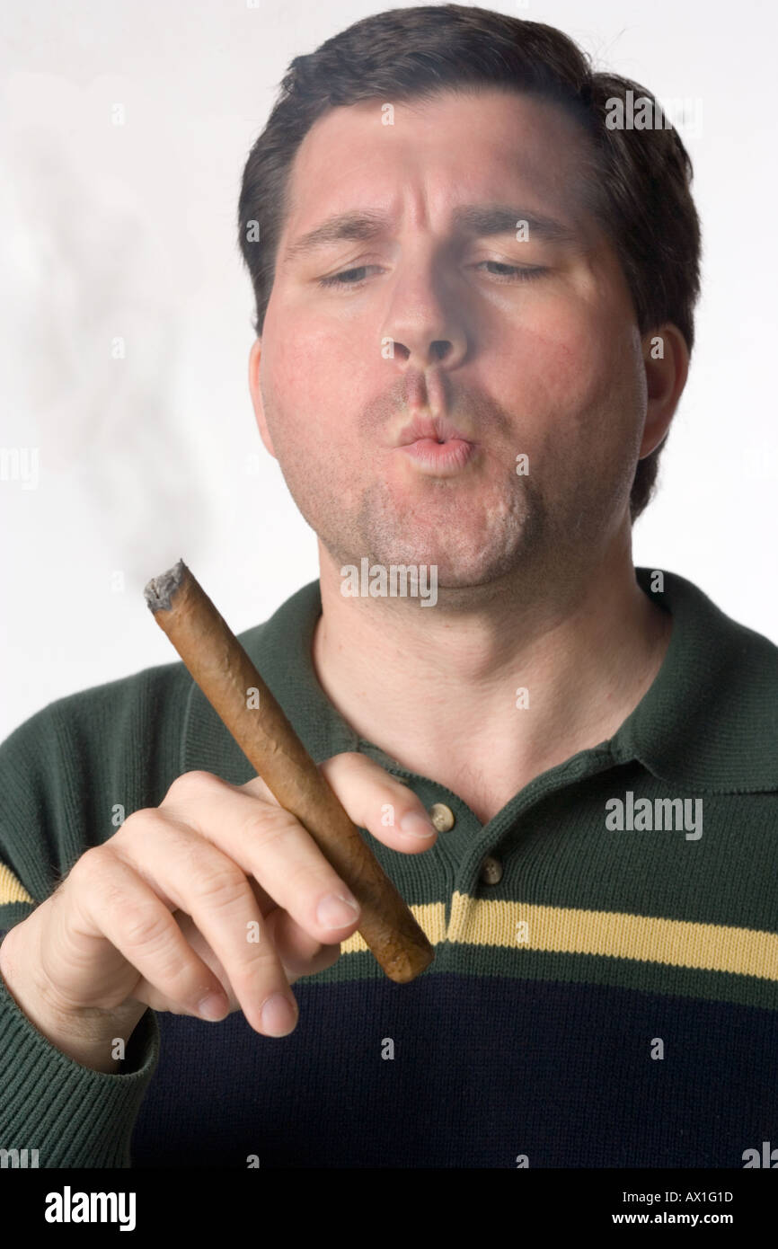 Portrait Caucasian man smoking cigar Stock Photo - Alamy